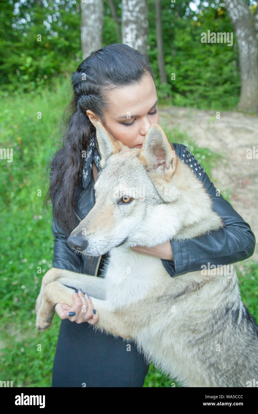 Adult pretty model girl with real mix animal of wolf and dog Stock ...