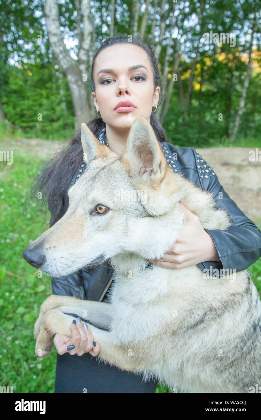 Adult pretty model girl with real mix animal of wolf and dog Stock ...