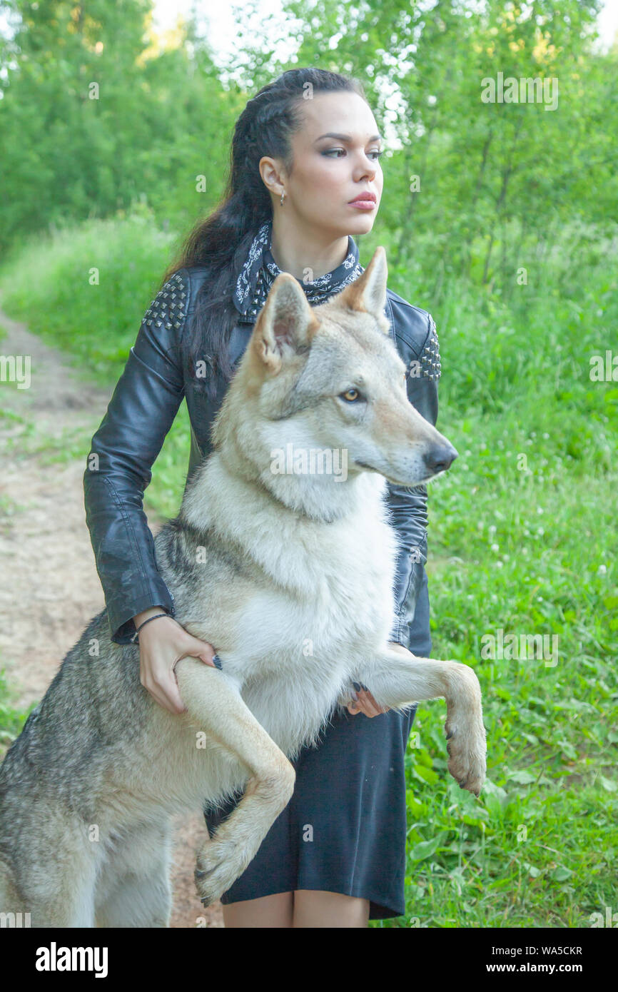 Adult pretty model girl with real mix animal of wolf and dog Stock ...