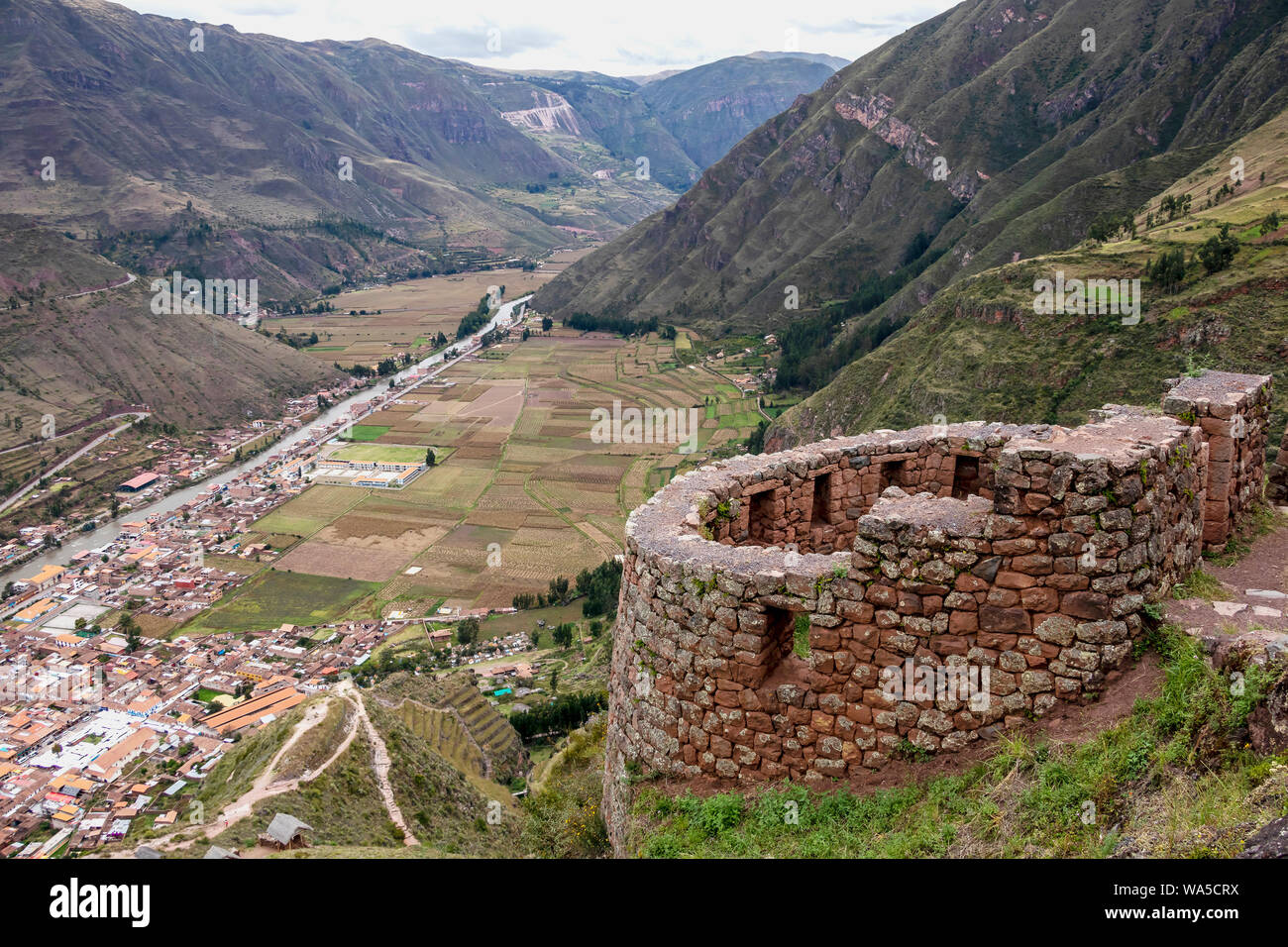 Inca ruins in Pisac archeological site surrounded by green Andes ...