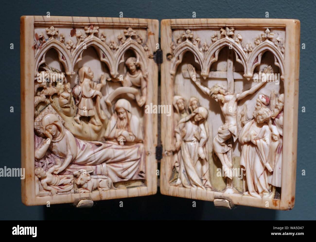 Diptych with Nativity and Crucifixion scenes, French, mid 1300s, ivory with traces of original ...