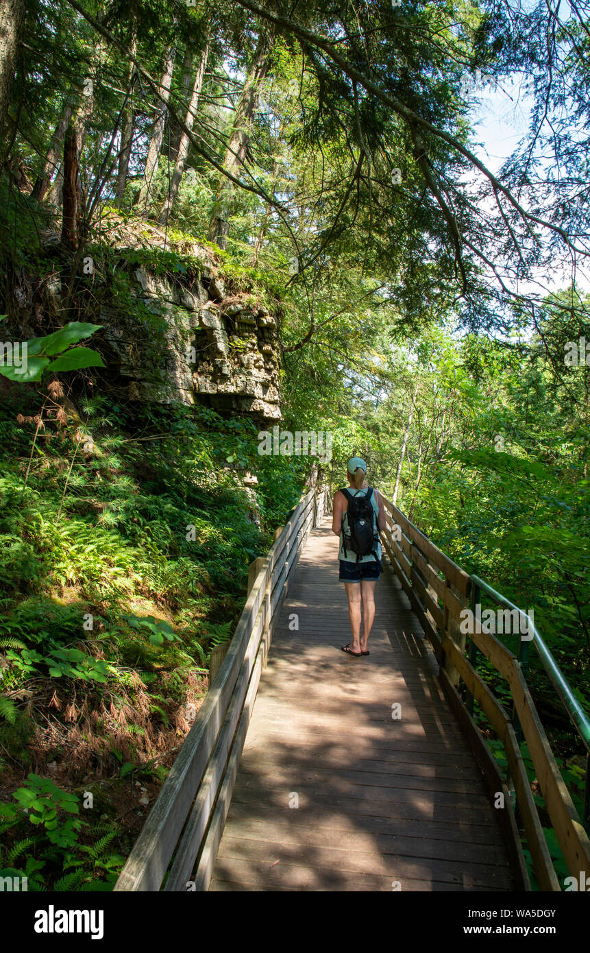 female hiker walking along the trail of the chasm Stock Photo - Alamy