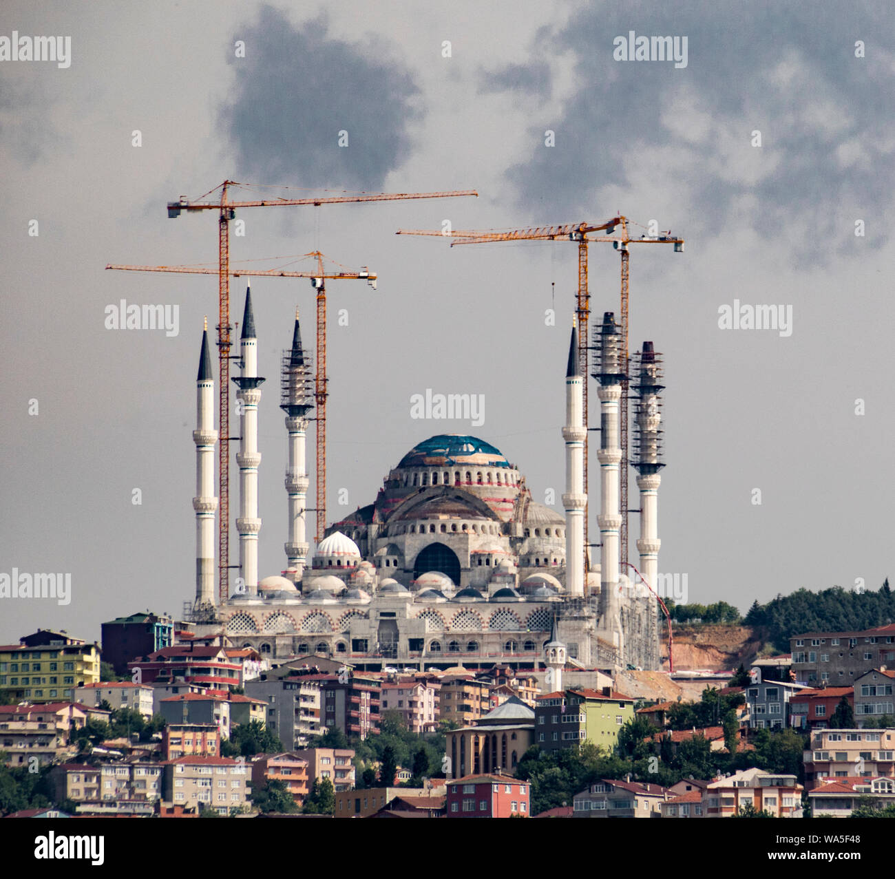 Construction cranes can be seen as mosque is being restored in Istanbul ...