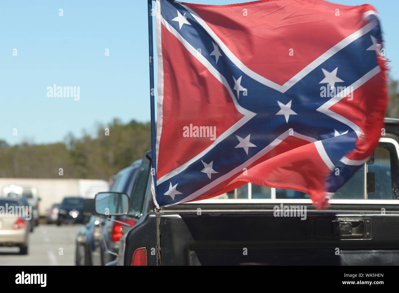 A confederate flag waves from the back of a pickup in Georgia Stock ...