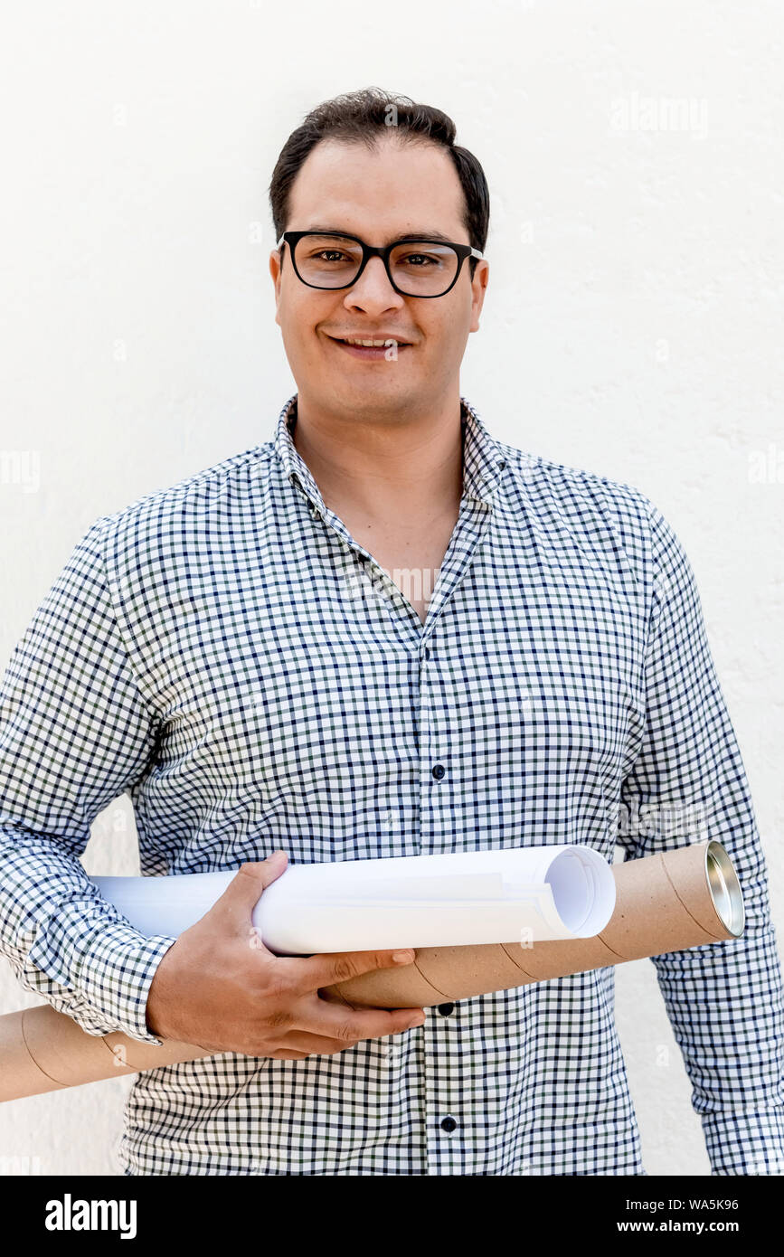 Portrait of an architect with blueprints Stock Photo - Alamy