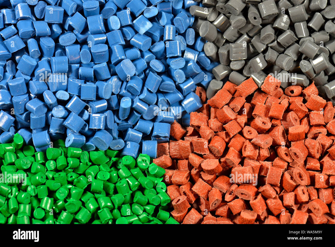 dyed polymer pellets for injection moudling process Stock Photo - Alamy