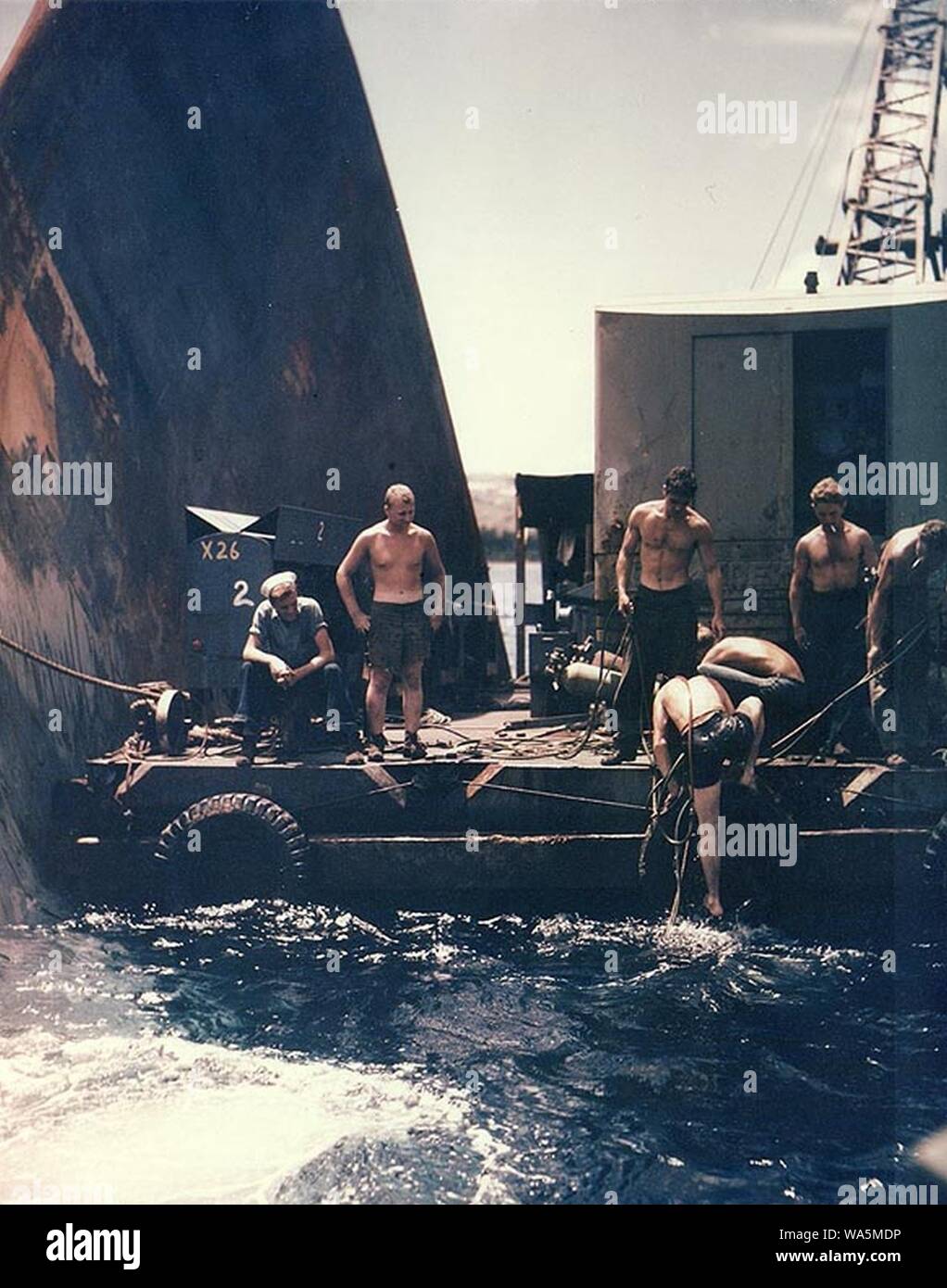 Divers working on severed bow of USS Pittsburgh (CA-72) in 1945 Stock ...