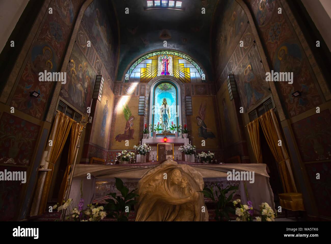 Bucharest, Romania - August 13, 2019: The altar with the statue of the ...