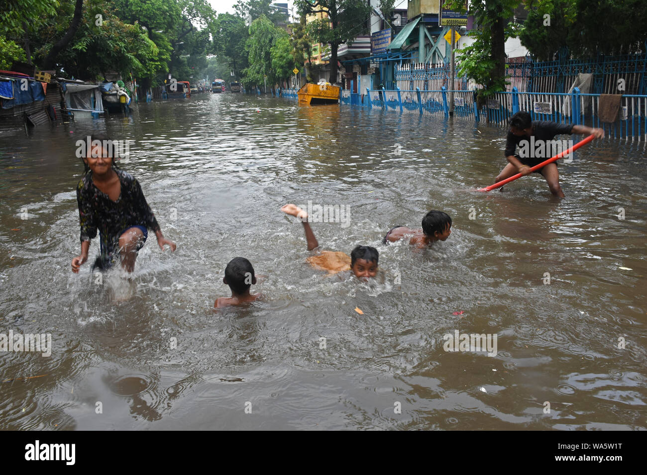Children playing in flood water hi-res stock photography and images - Alamy