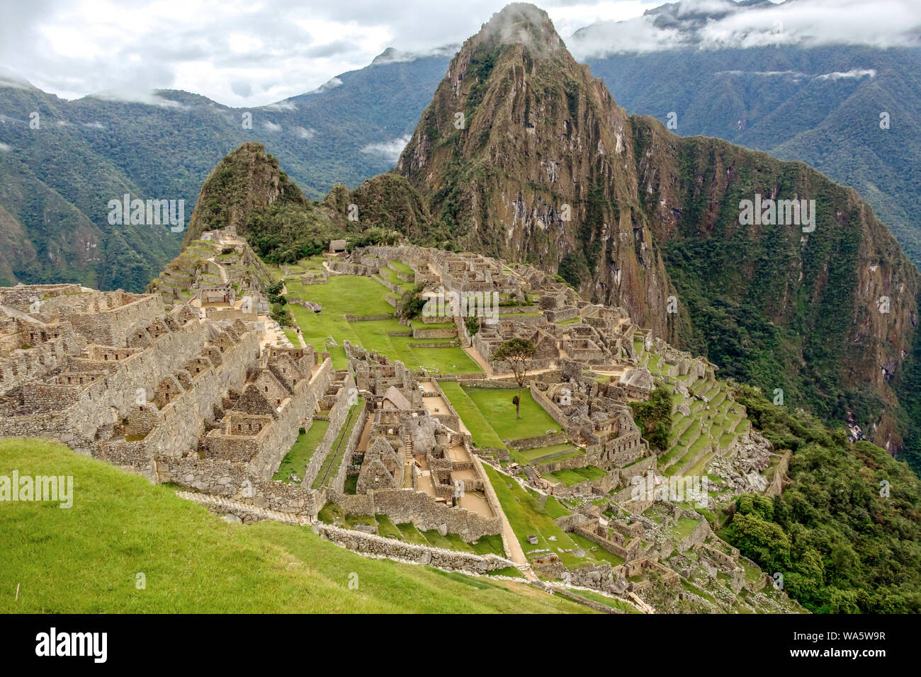 Machu Picchu Incan citadel, abandoned ruins of buildings, walls, plazas ...