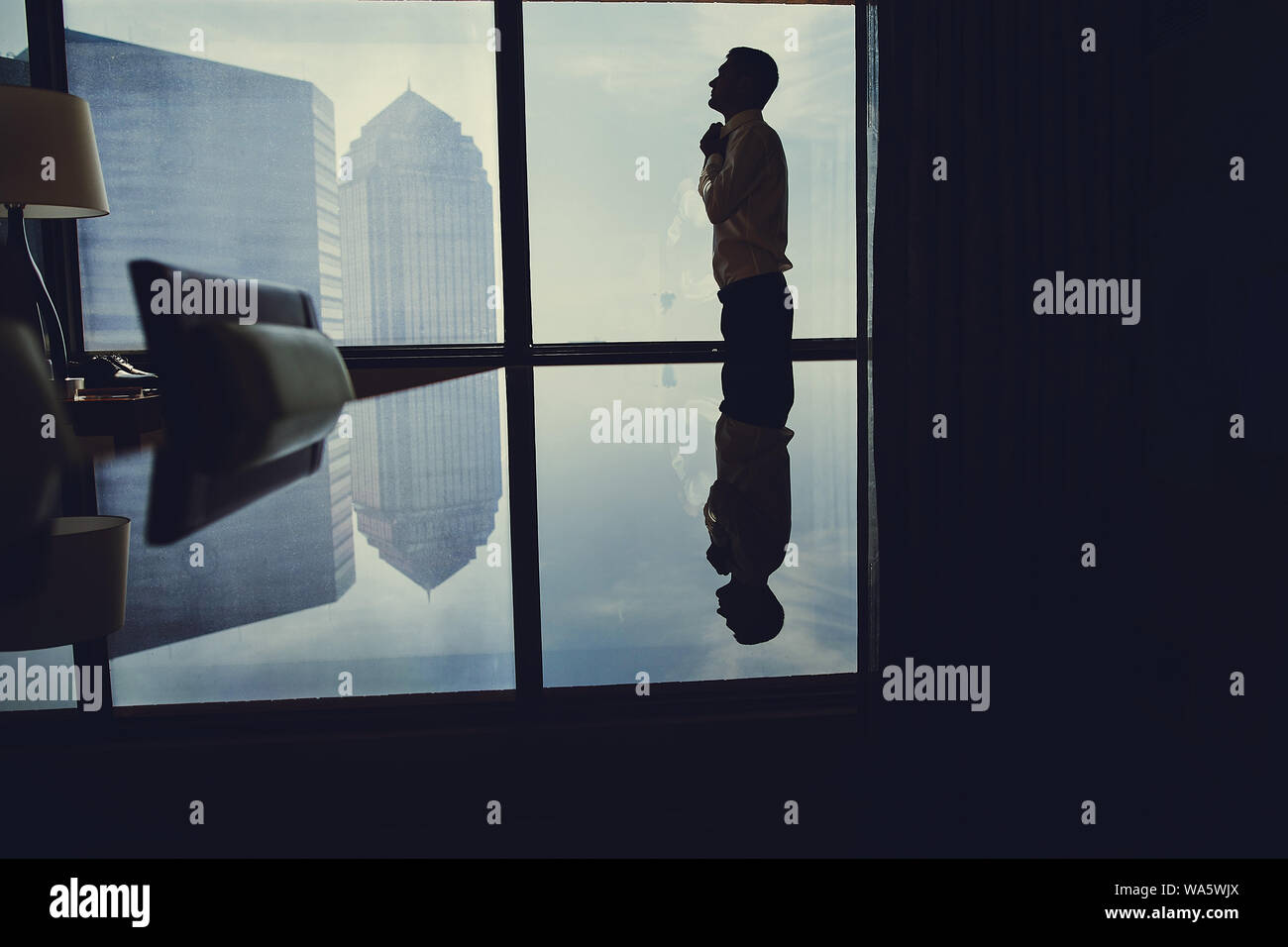 Man near window Stock Photo - Alamy