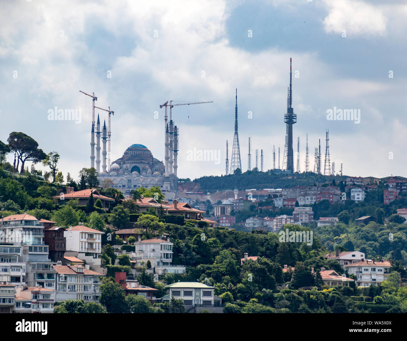 Construction cranes can be seen as mosque is being restored in Istanbul ...
