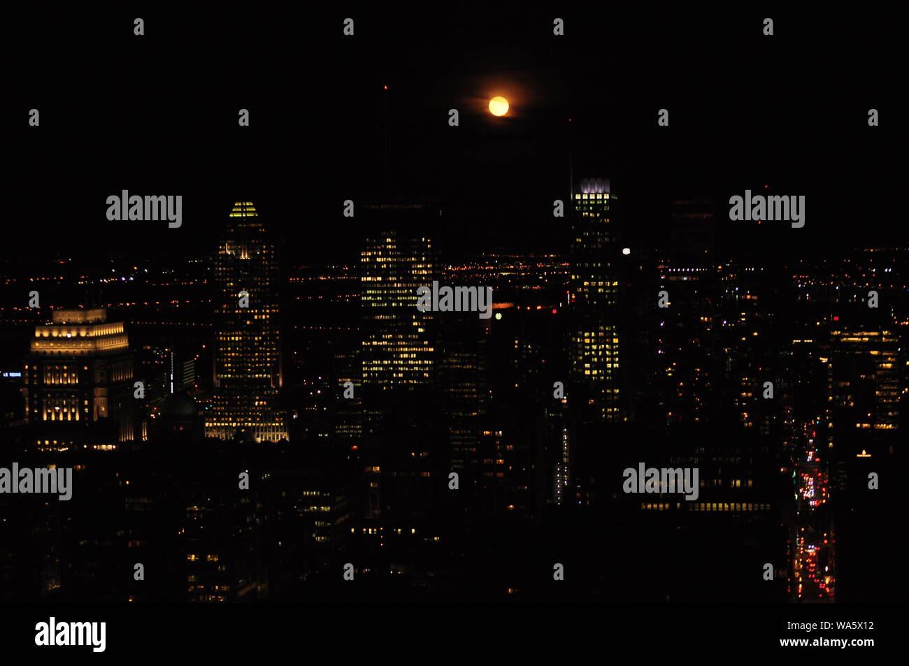 Full moon rise above the city of Montreal Stock Photo - Alamy