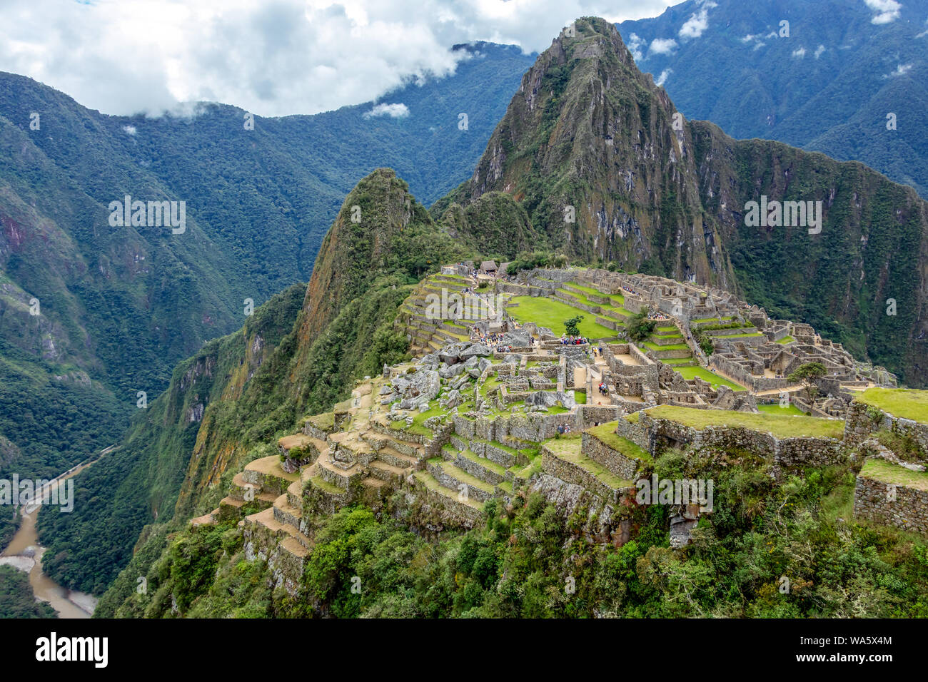 Machu Picchu Incan citadel, abandoned ruins of buildings, walls, plazas ...