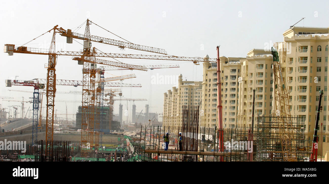 Construction site with worker in Dubai, United Arab Emirates. Dubai was ...