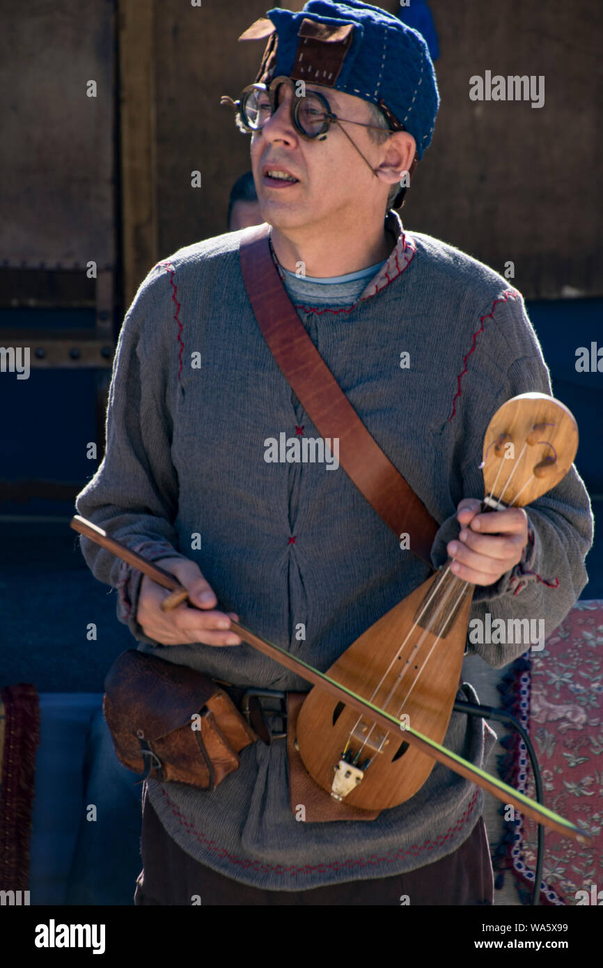 Penedono , Portugal - July 1, 2017 - Man plays Rebec string instrument ...