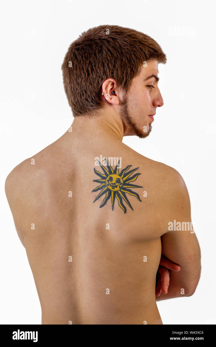 Young man with a stylized sun on his back Stock Photo - Alamy