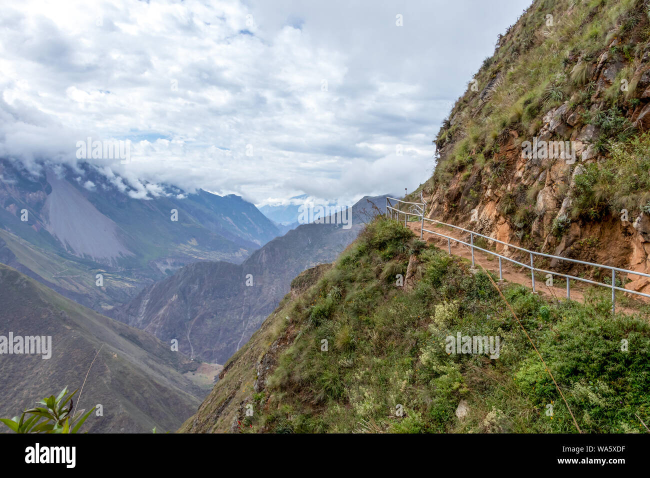 Hiking path at high altitude Peruvian mountains, Green steep slopes of ...