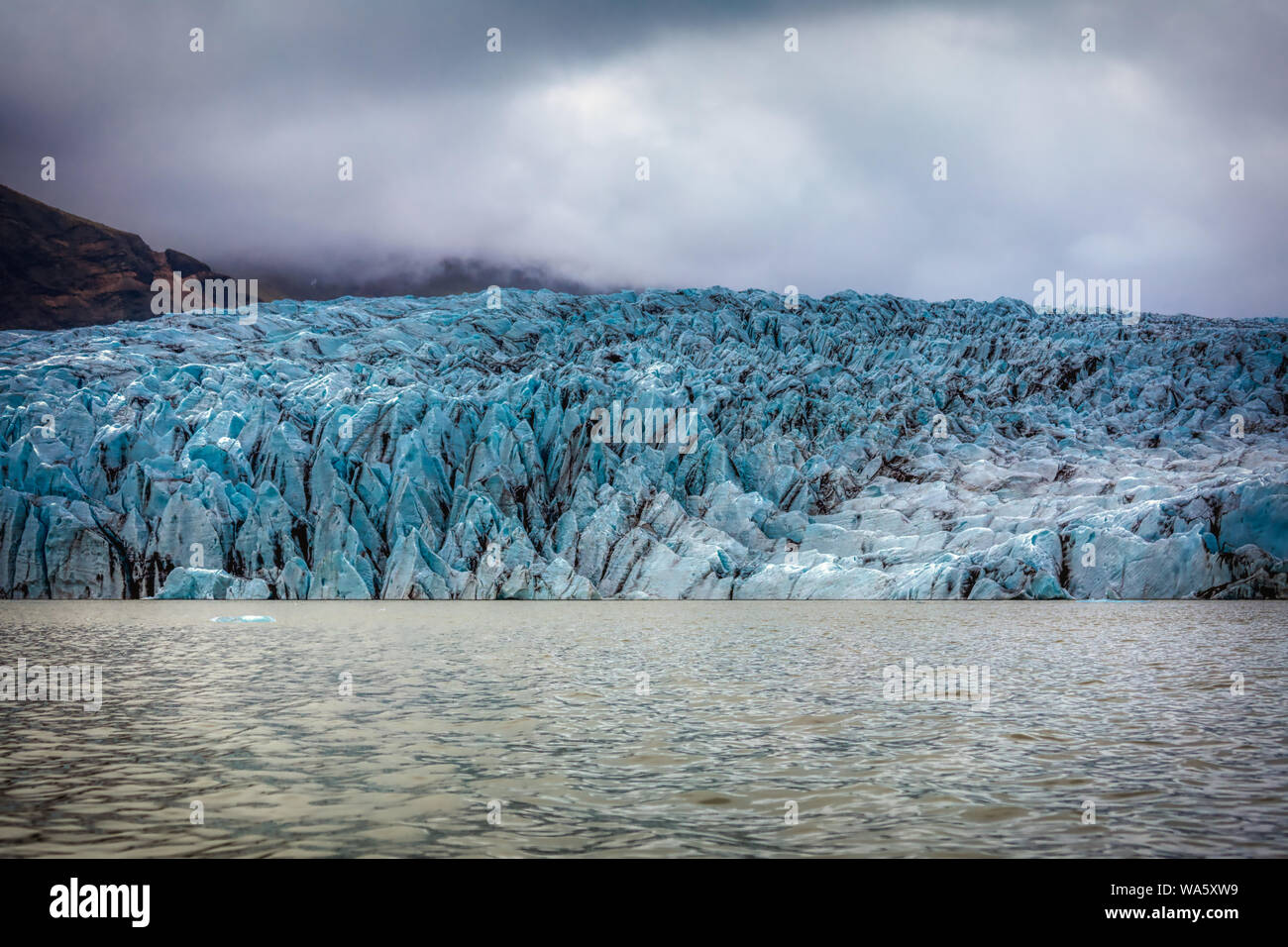 beautiful blue shining glacier structure at the lagoon fjallsarlon on ...
