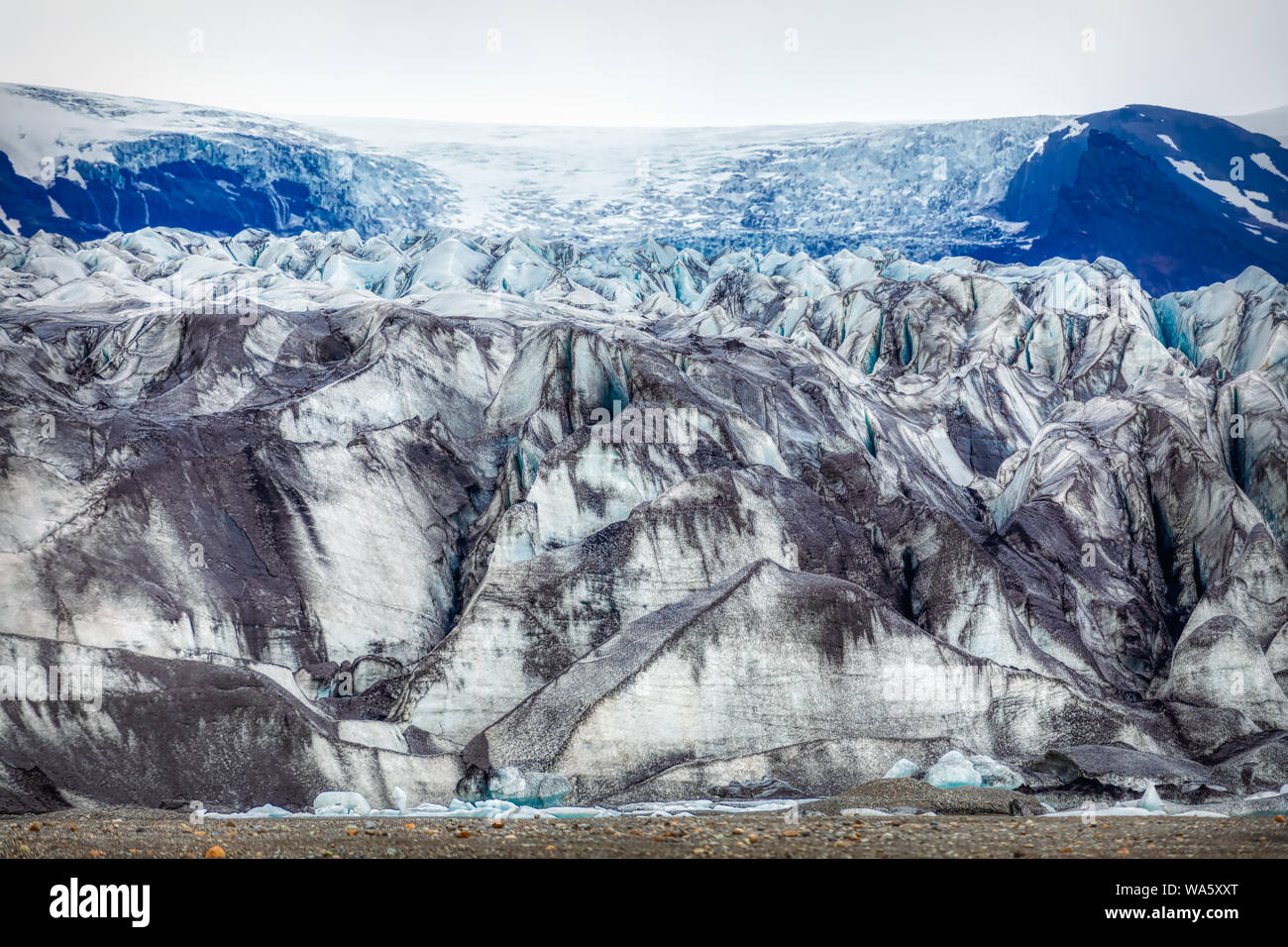 beautiful blue shining glacier structure at the lagoon fjallsarlon on ...