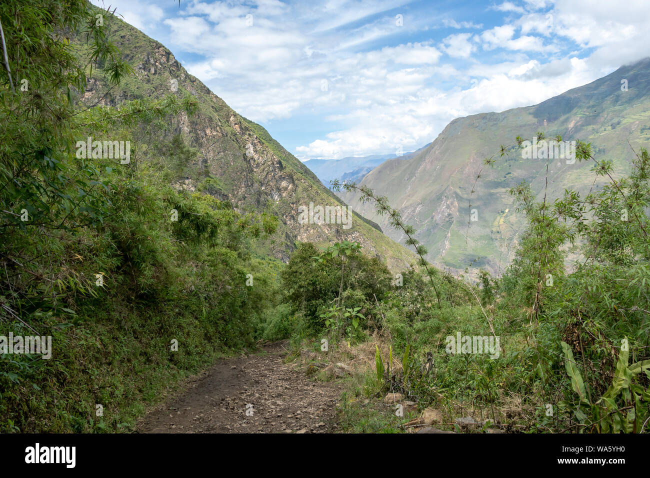 Hiking path at high altitude Peruvian mountains, Green steep slopes of ...