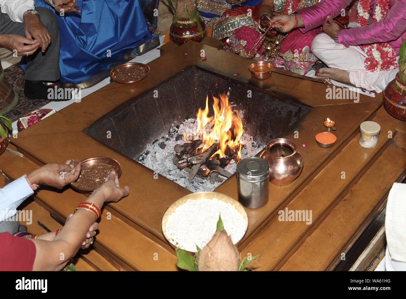 Newlywed couple performing traditional ritual in wedding ceremony Stock ...