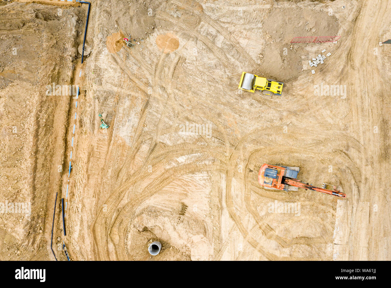 top view of construction site. excavators and dump trucks loading sand ...