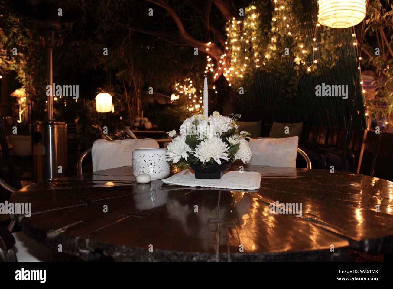 Outdoor scene of table arrangement of a restaurant at night Stock Photo ...