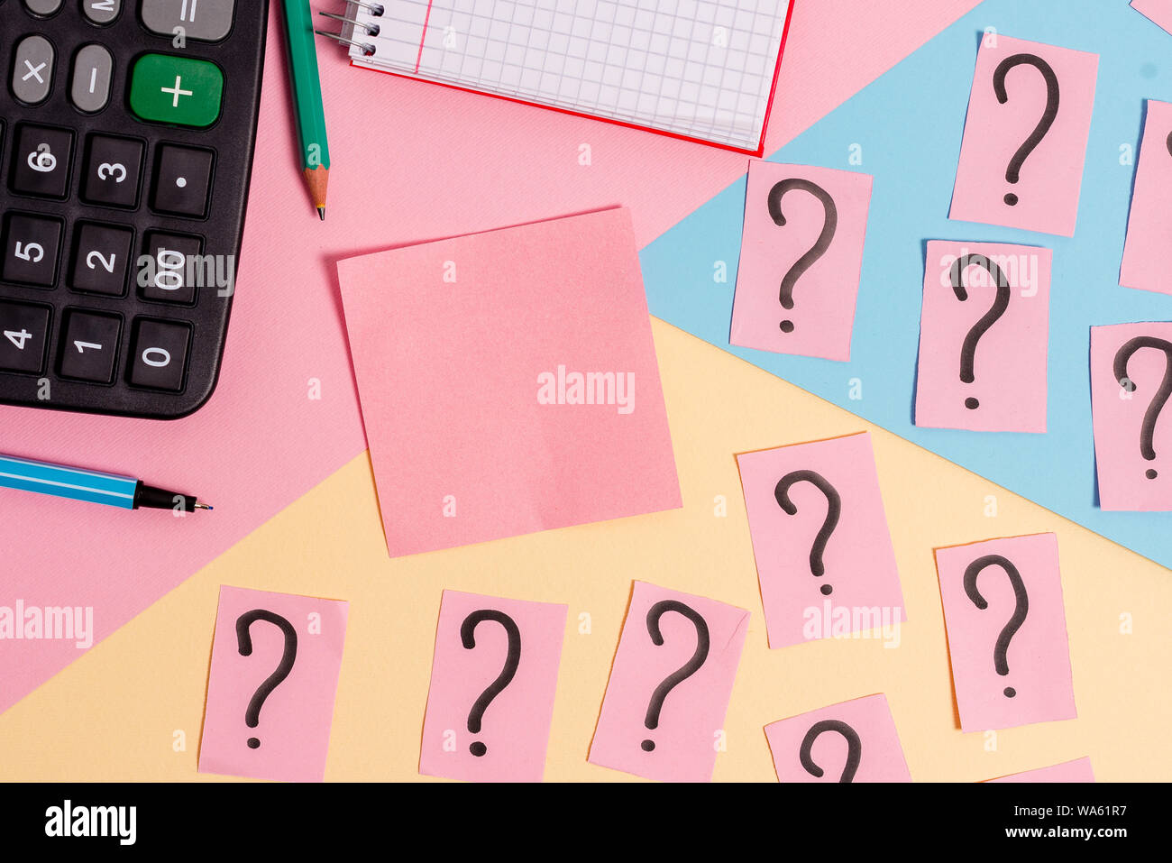Mathematics stuff and writing equipment above pastel colours background ...
