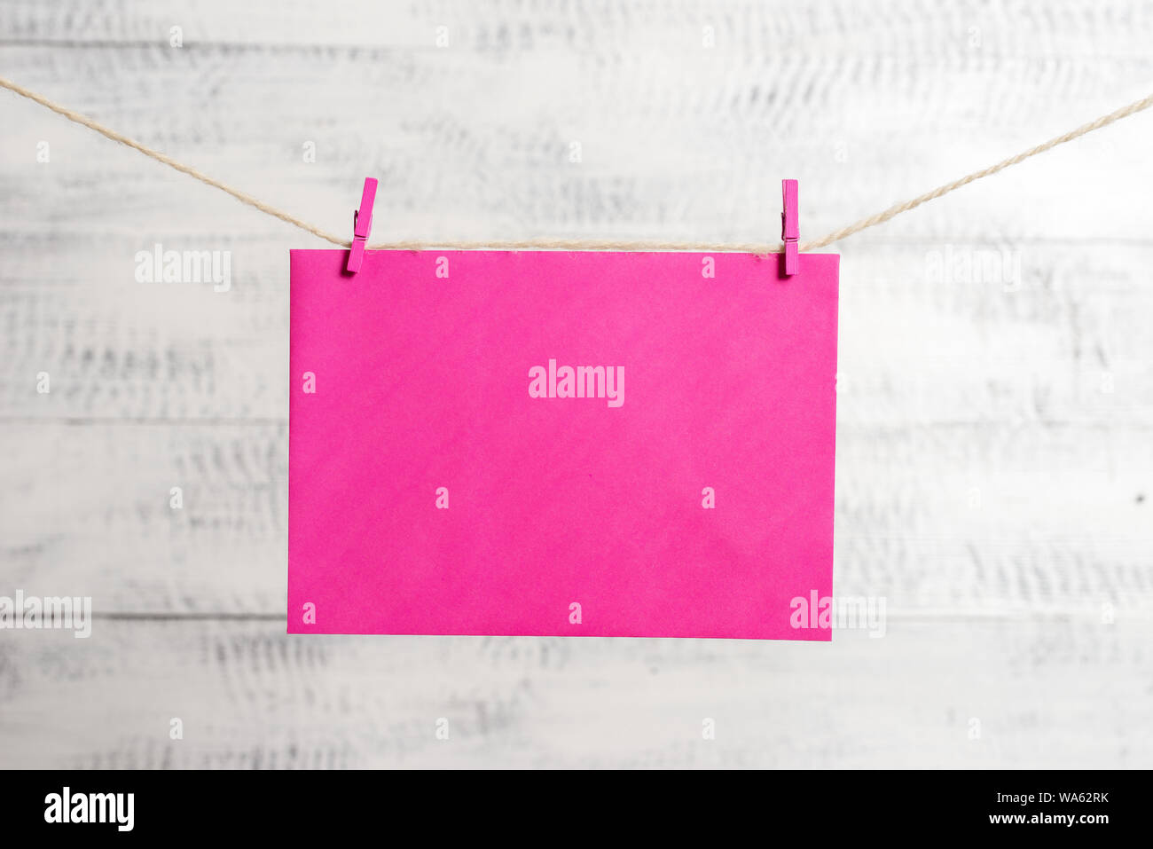 Clothesline clothespin rectangle shaped paper reminder white wood desk ...