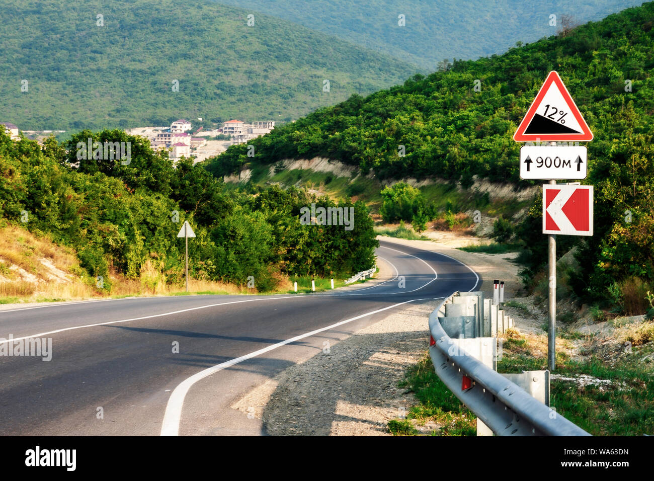 Road signs mounted on a mountain road Stock Photo - Alamy