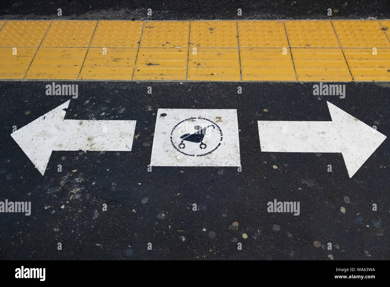 Sign on a platform at a train station indicating where parents with ...