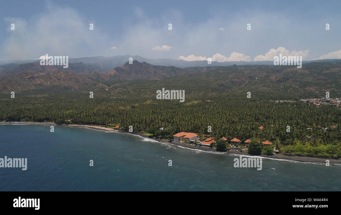 aerial seascape luxury hotel on beach background mountainss in tropical ...