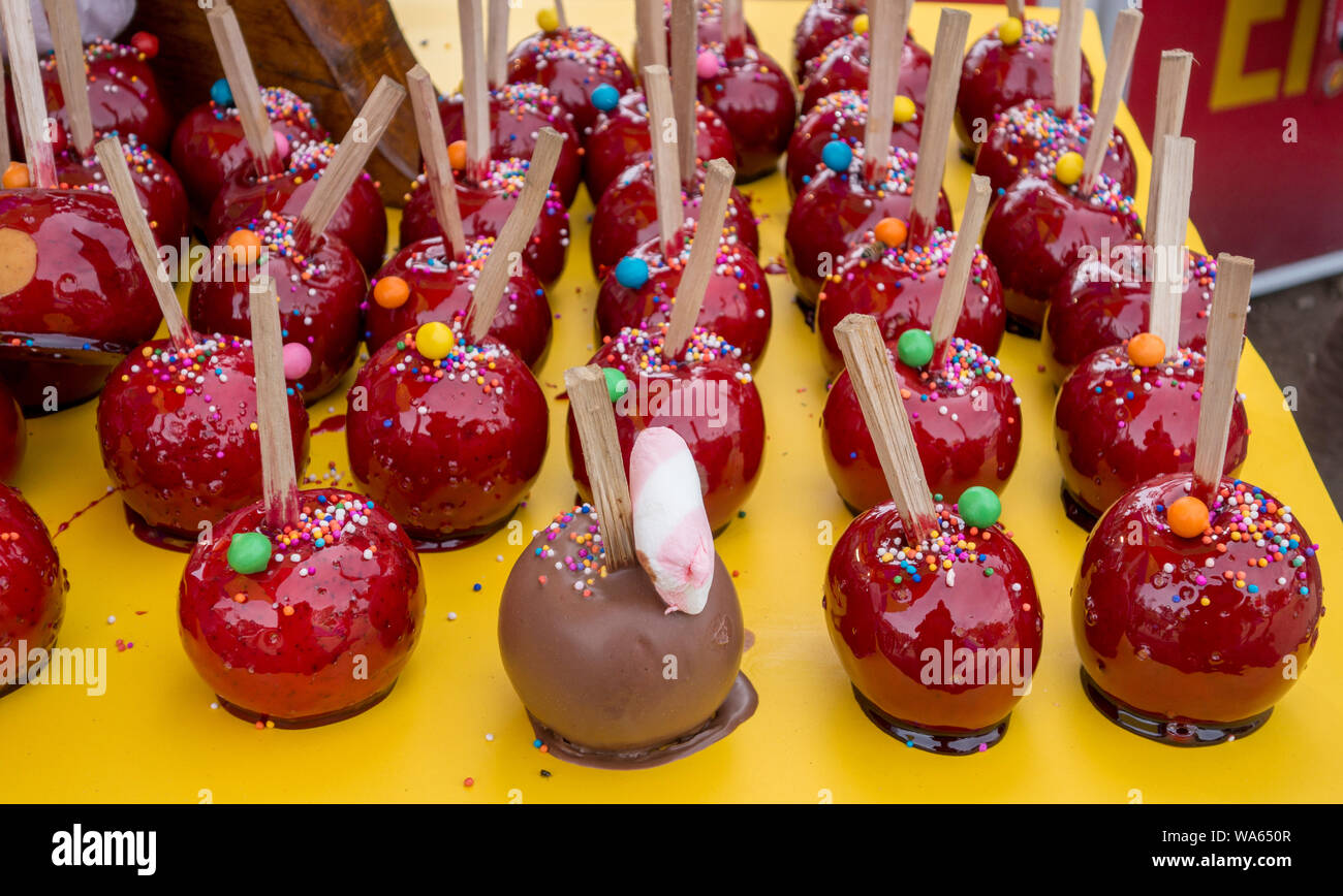 Candied apples on display at street fair Stock Photo - Alamy