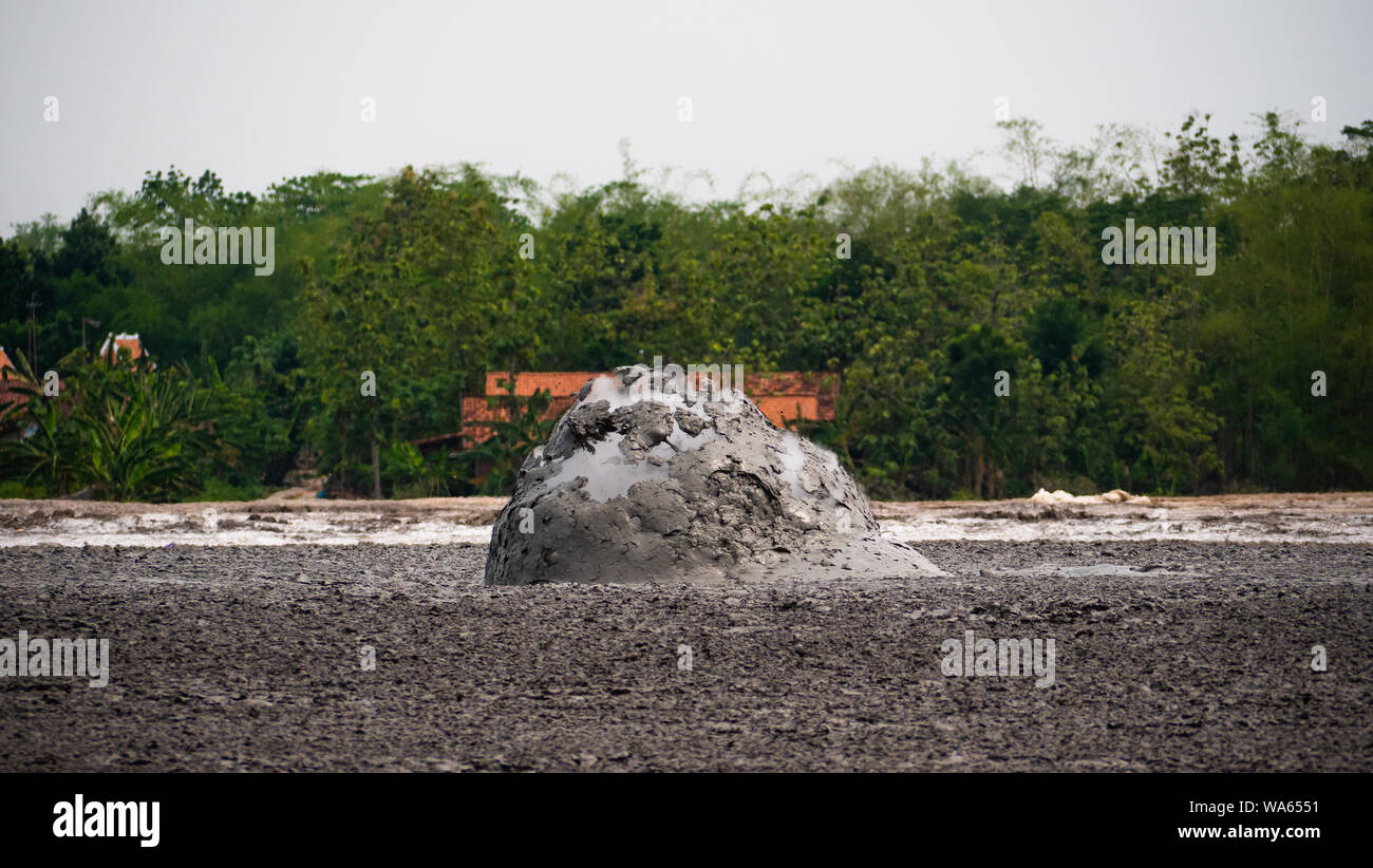 mud volcano with bursting bubble bledug kuwu. volcanic plateau with ...