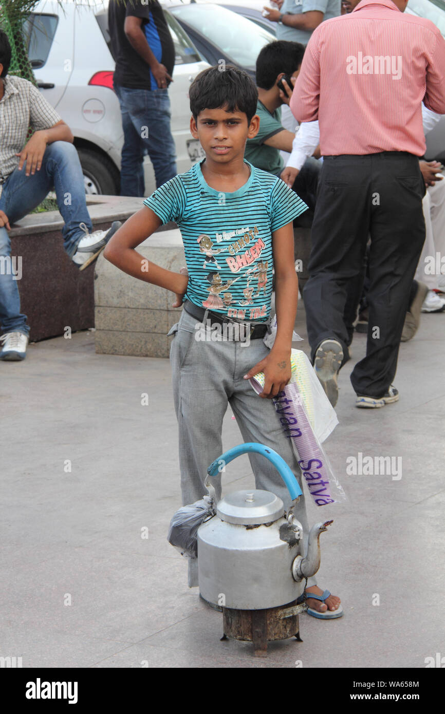 Boy selling tea at a market stall Stock Photo - Alamy