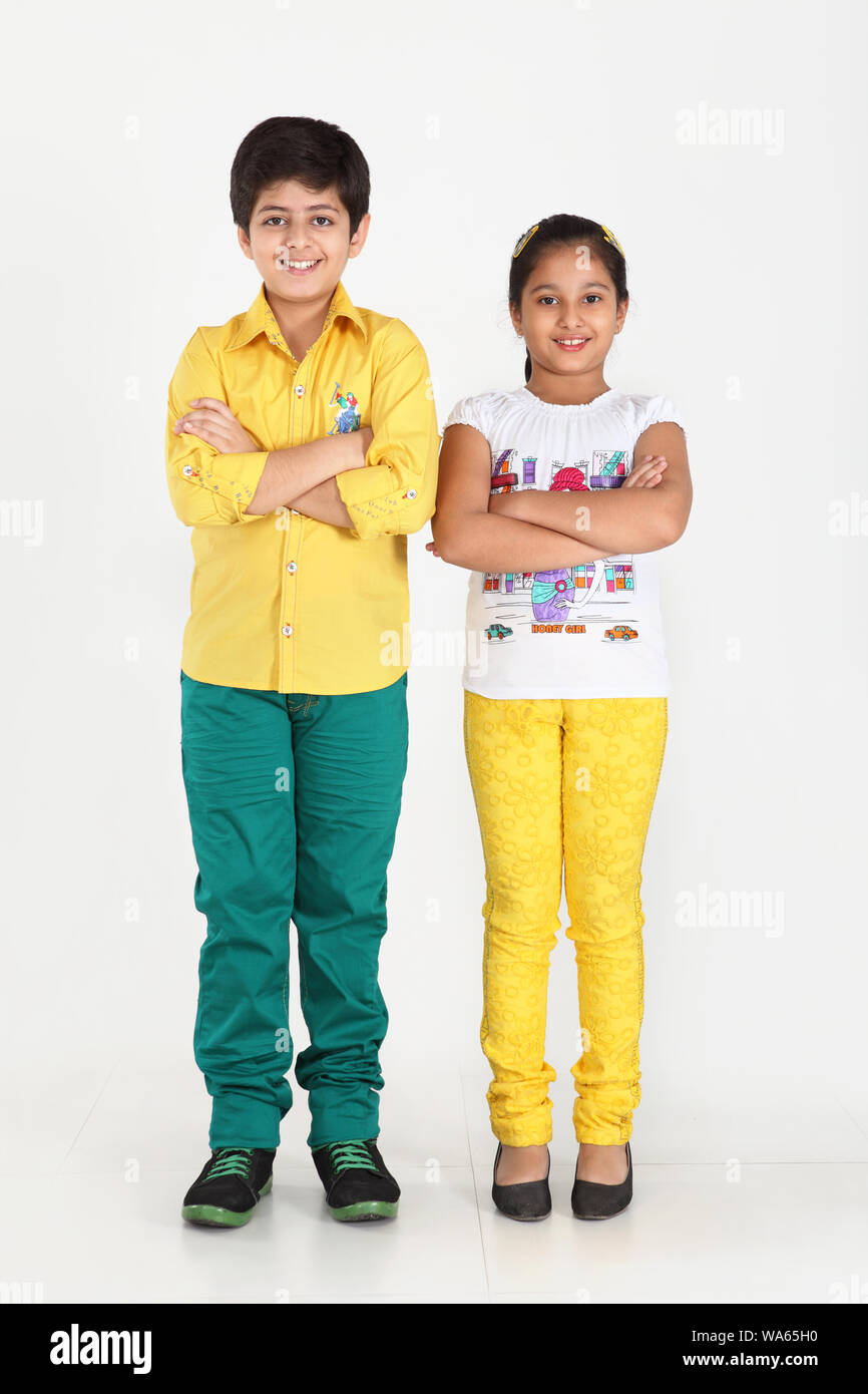 Two friends standing with their arms crossed and smiling Stock Photo ...