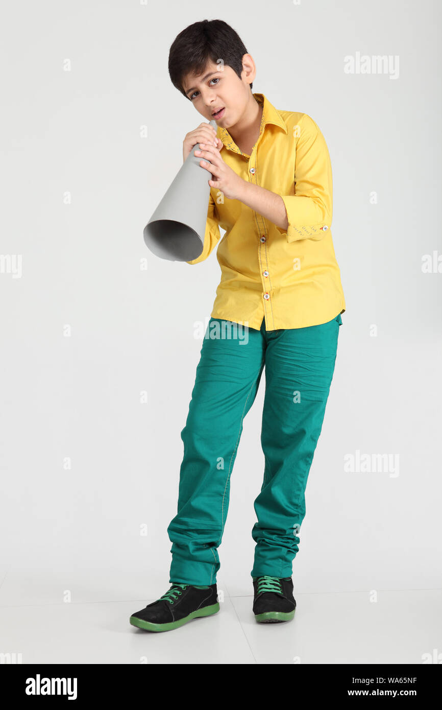 Boy shouting into a paper megaphone Stock Photo - Alamy