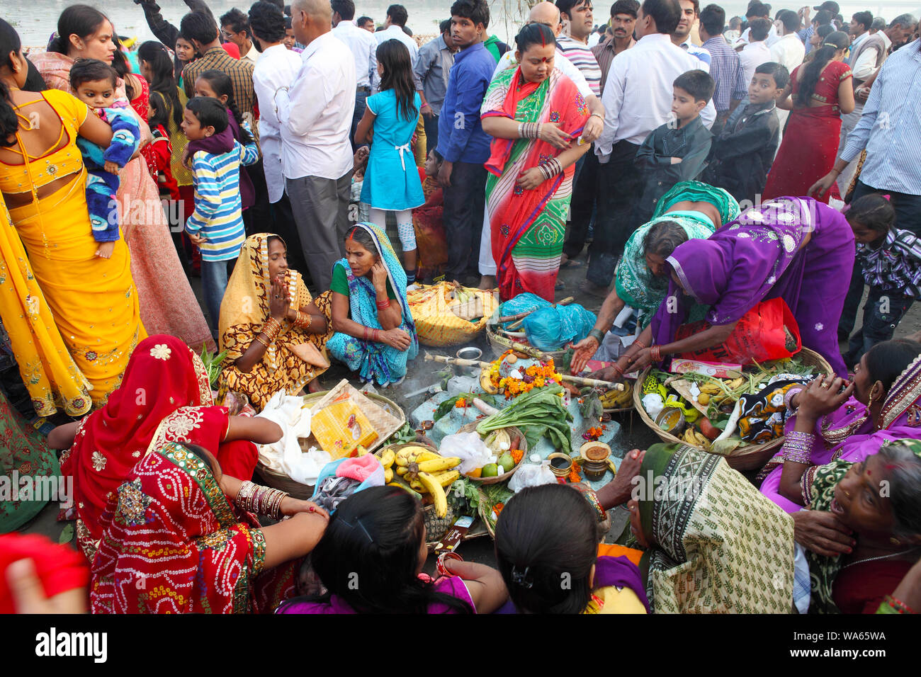 Group of people celebrating chhath puja festival at ghat Stock Photo ...