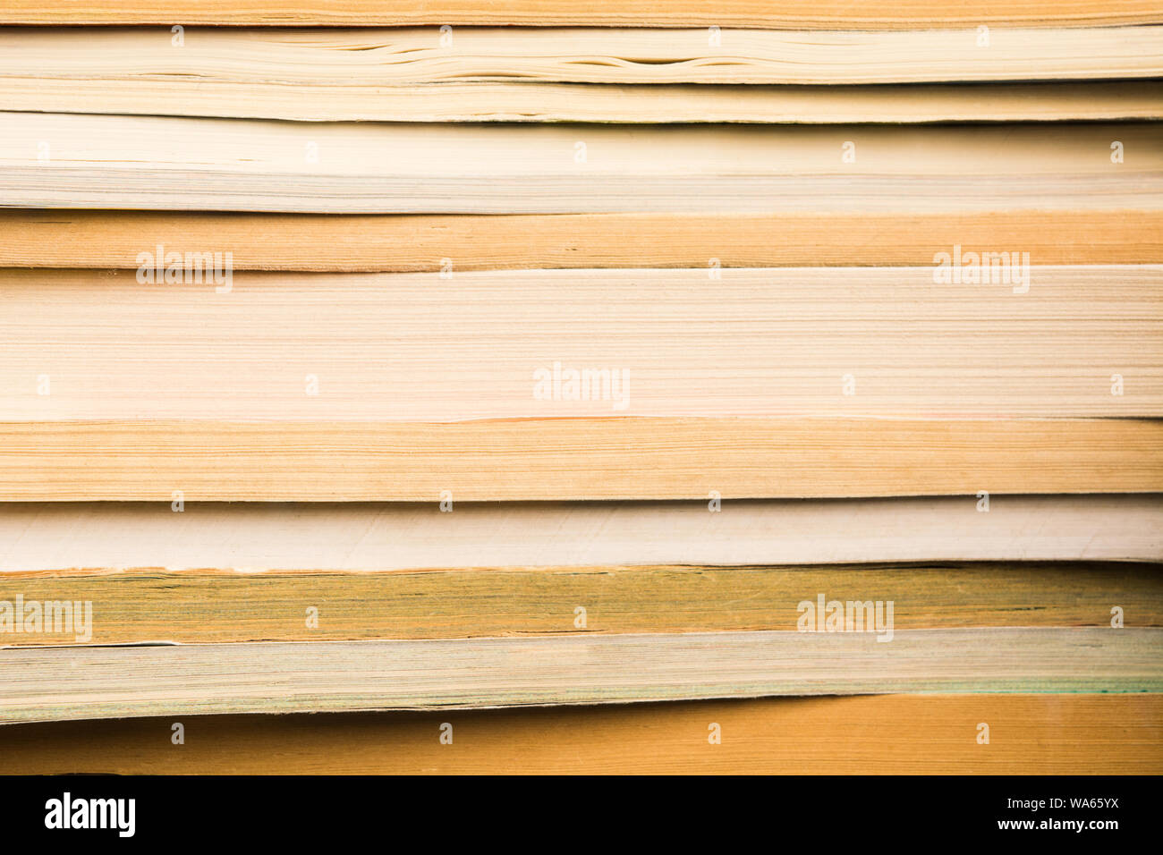 Vintage books in stack. Library with many old books background ...