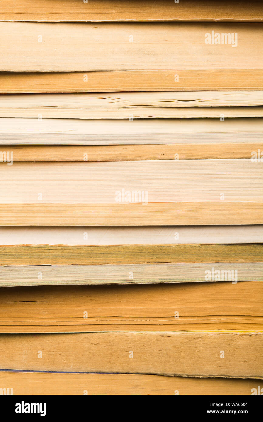 Vintage books in stack. Library with many old books background ...