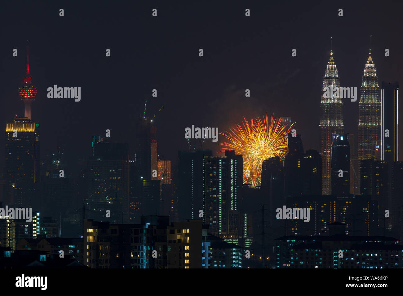 Fireworks explode over the Petronas Twin Towers during the midnight ...