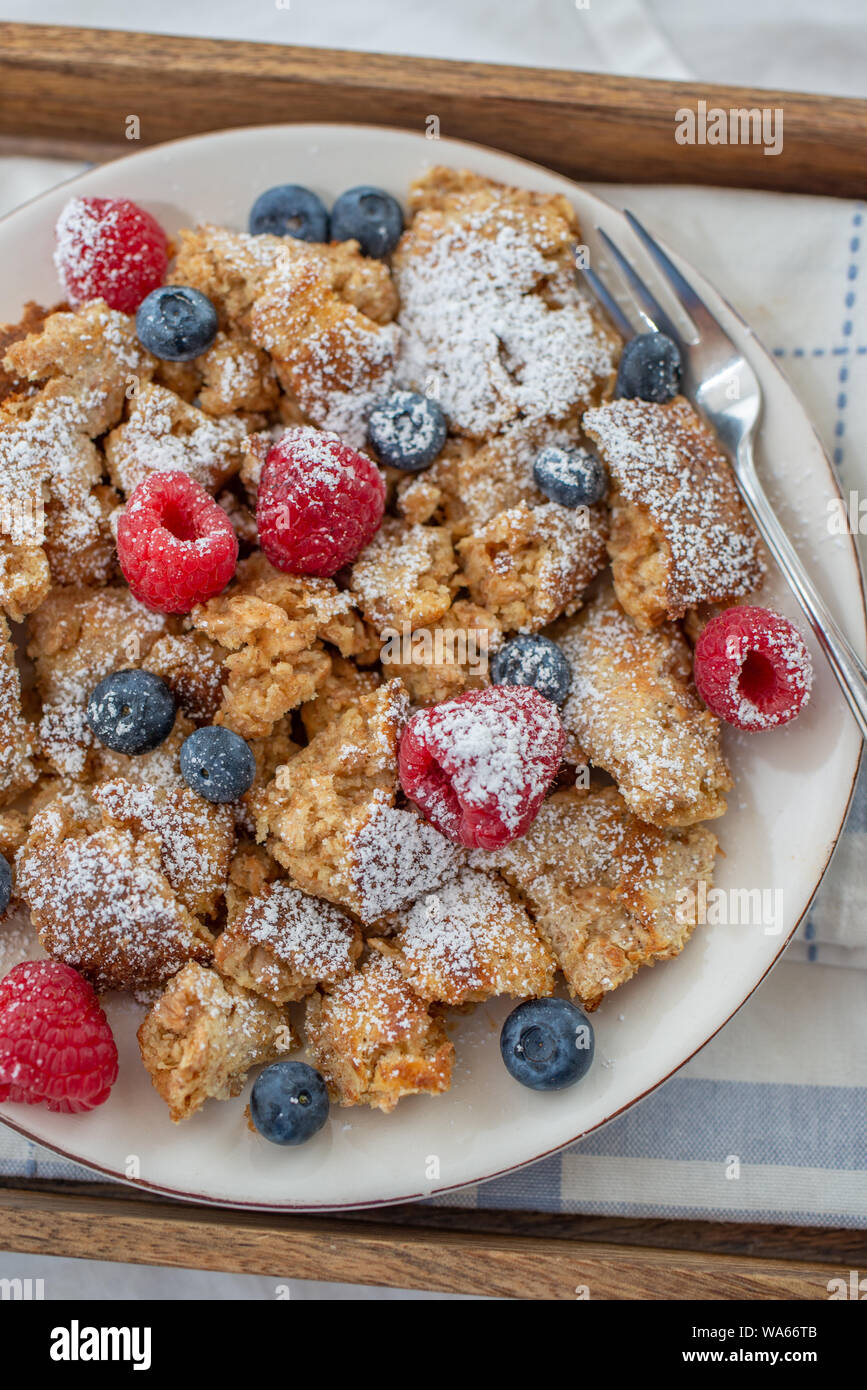 Kaiserschmarrn - traditional austrian pancake dessert with fresh fruit ...