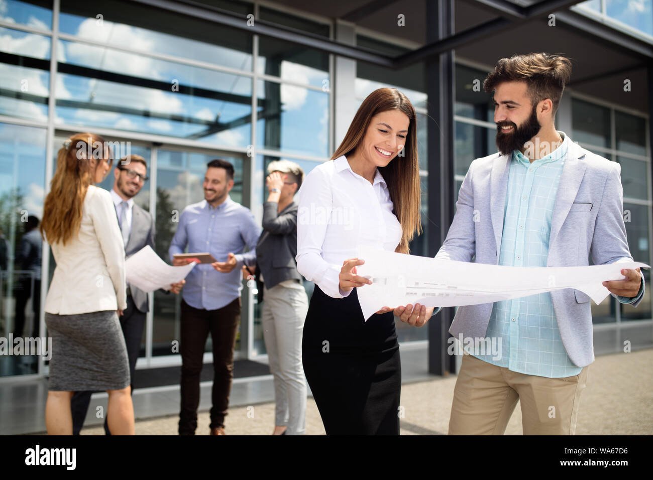 Group of architects working on new project Stock Photo - Alamy