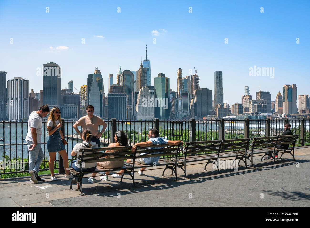 Young people New York, view in summer of a group of friends relaxing on ...