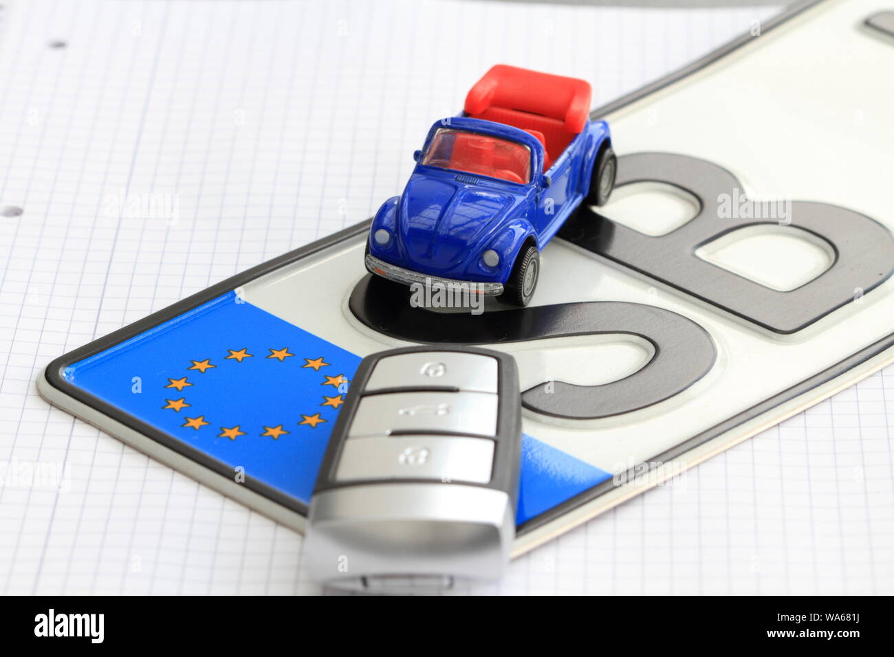 License plate with a car key Stock Photo - Alamy