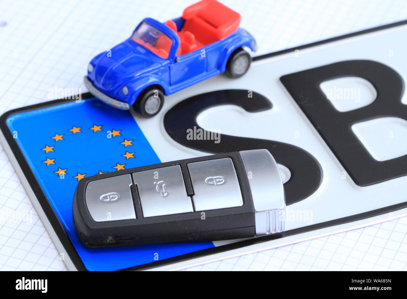 License plate with a car key Stock Photo - Alamy
