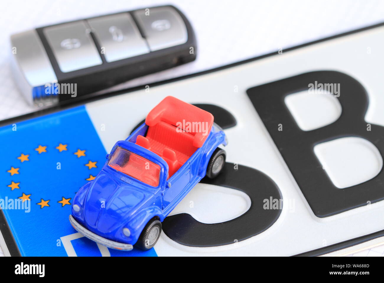 License plate with a car key Stock Photo - Alamy