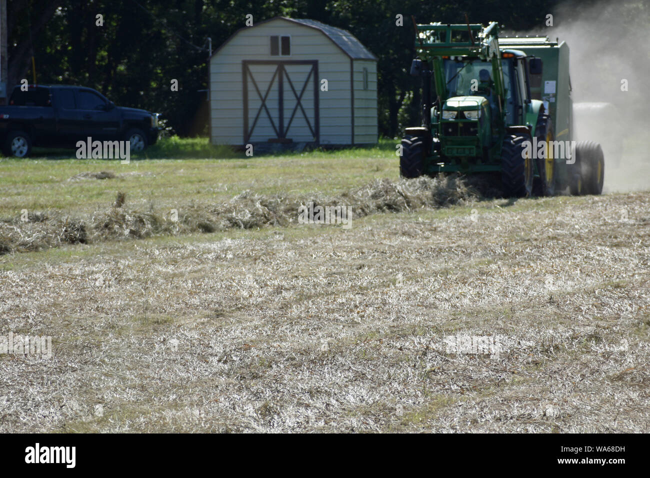 Alfalfa baling tractor and baler hi-res stock photography and images ...