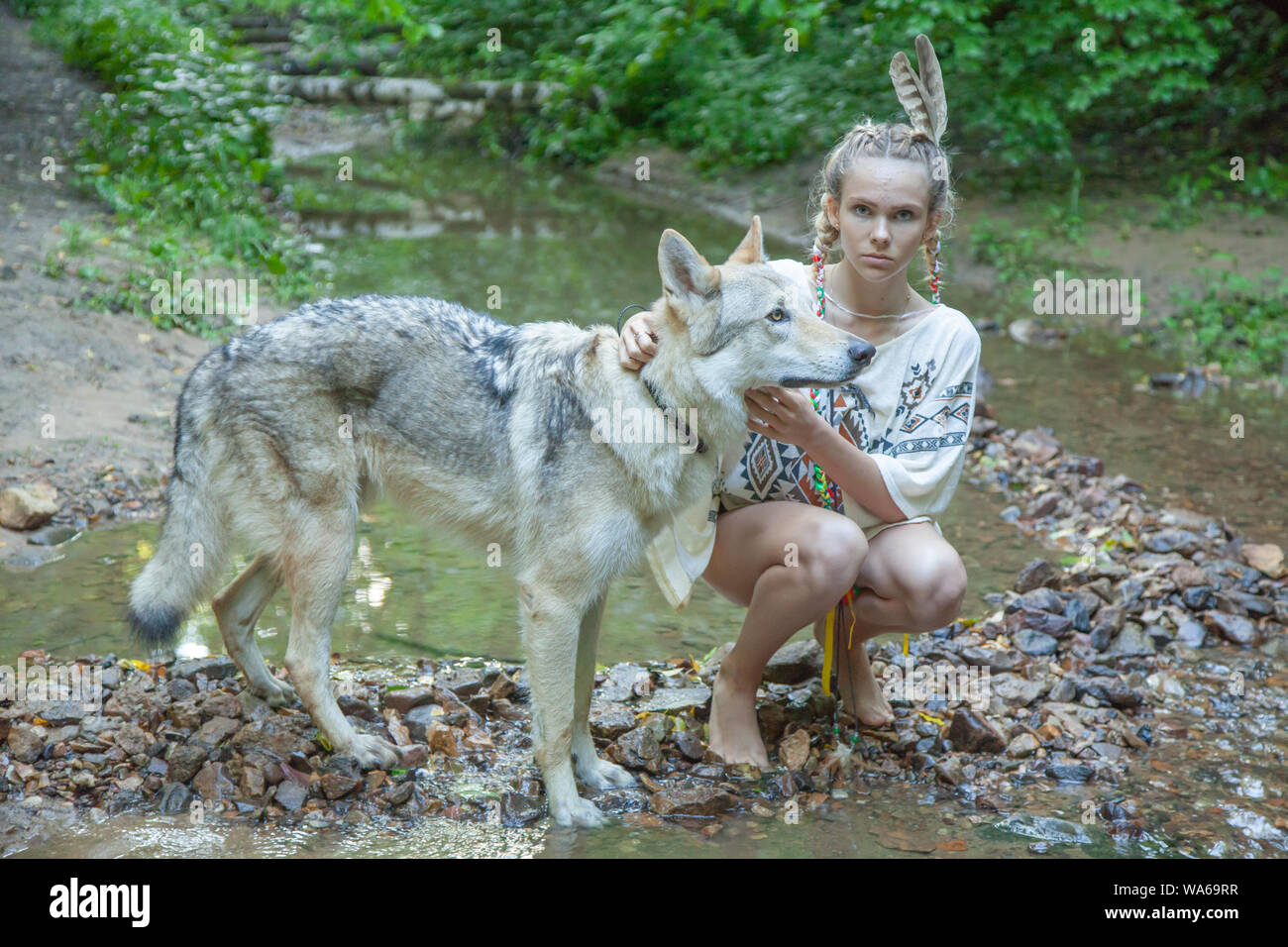 Girl And Wolf In Forest